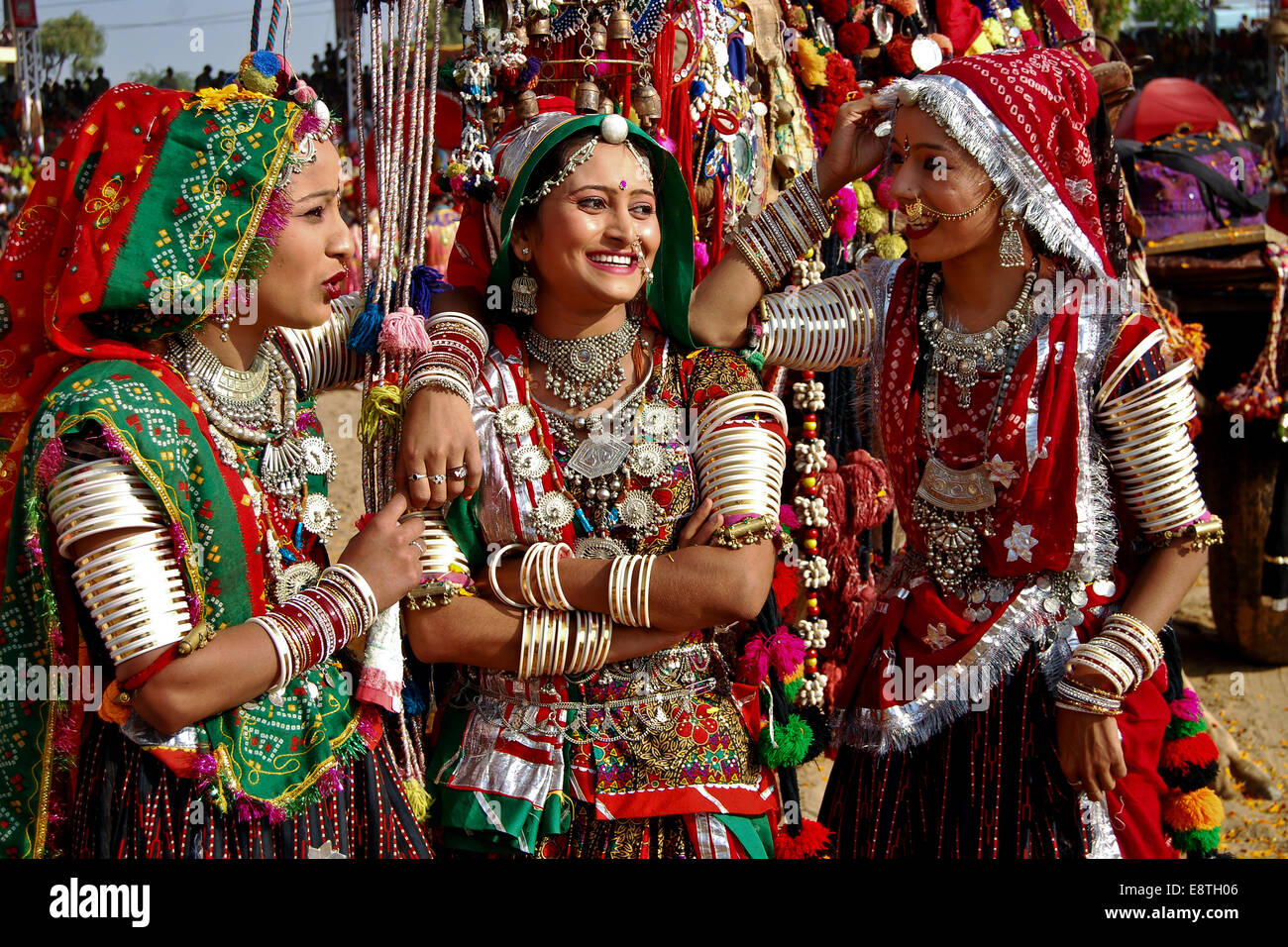 Three women performers in traditional Indian dresses and ornaments at ...