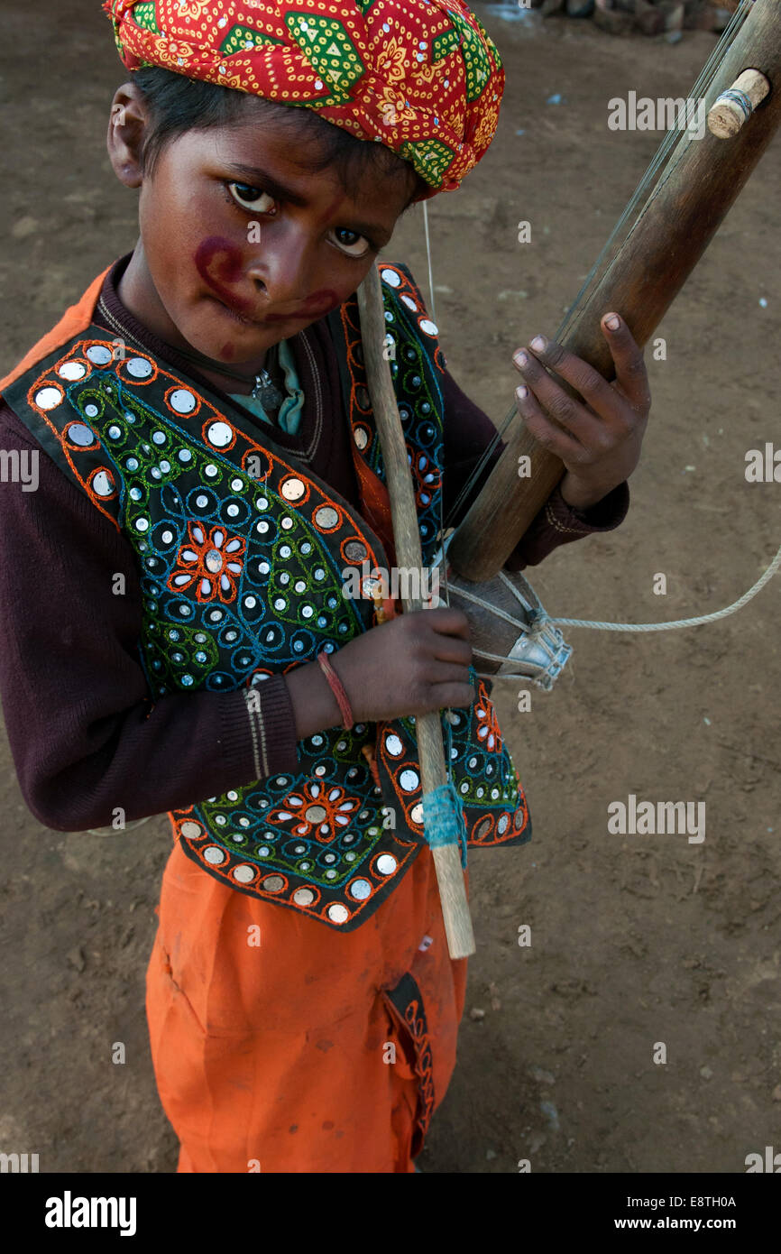 Boy playing rawanhattha(A traditional musical insrtument ), Pushkar ...