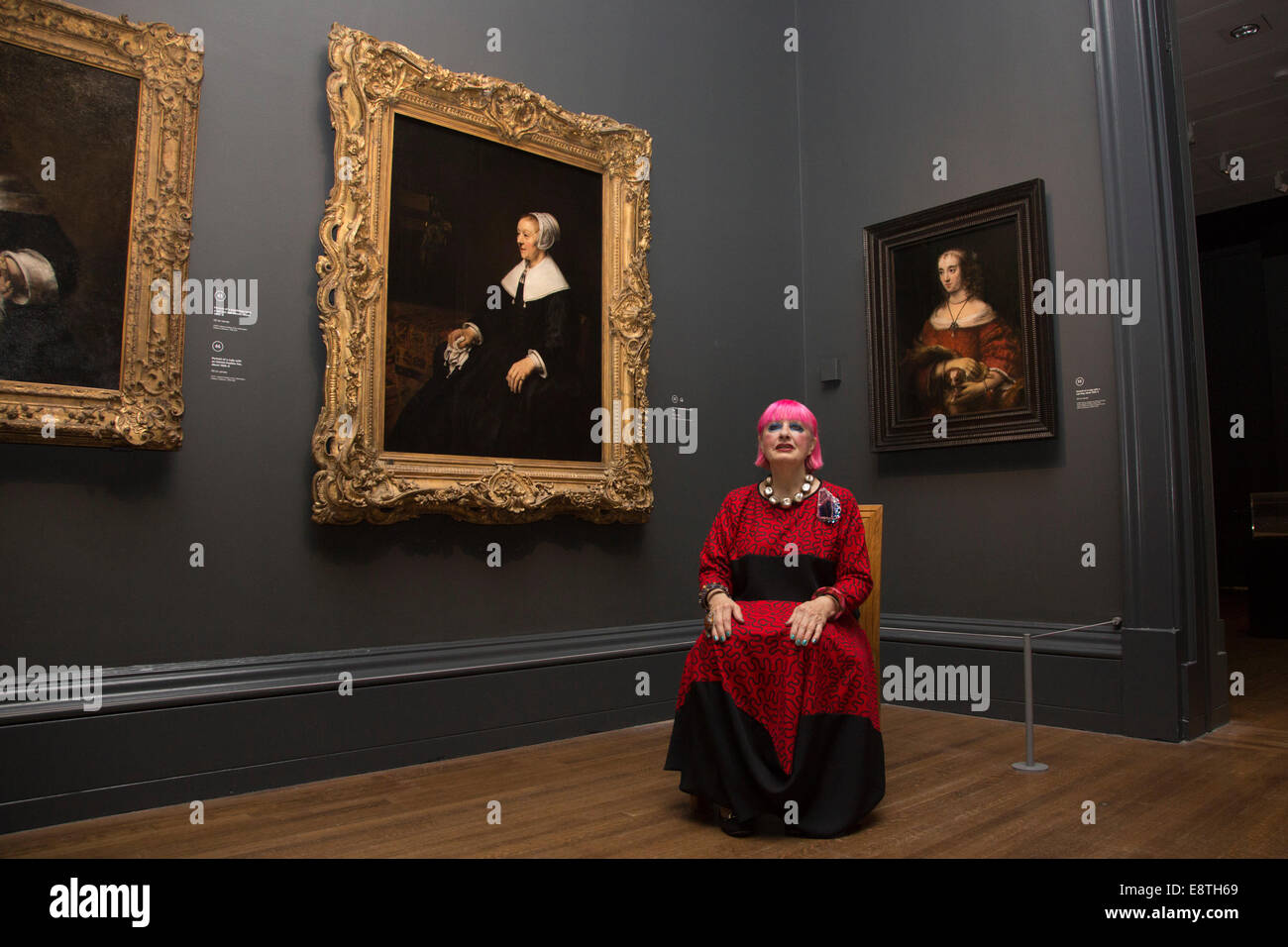 Dame Zandra Rhodes poses in front of the portrait of Catrina Hooghsaet ...
