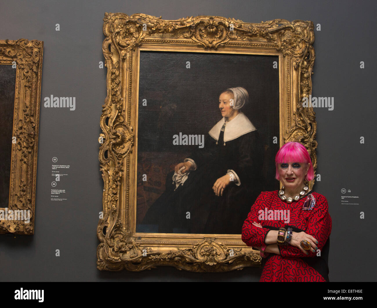 Dame Zandra Rhodes poses in front of the portrait of Catrina Hooghsaet ...