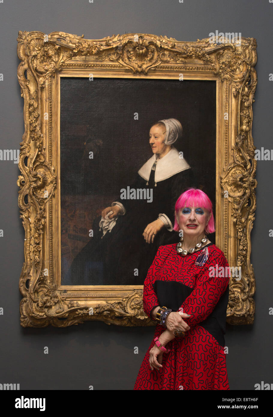 Dame Zandra Rhodes poses in front of the portrait of Catrina Hooghsaet ...
