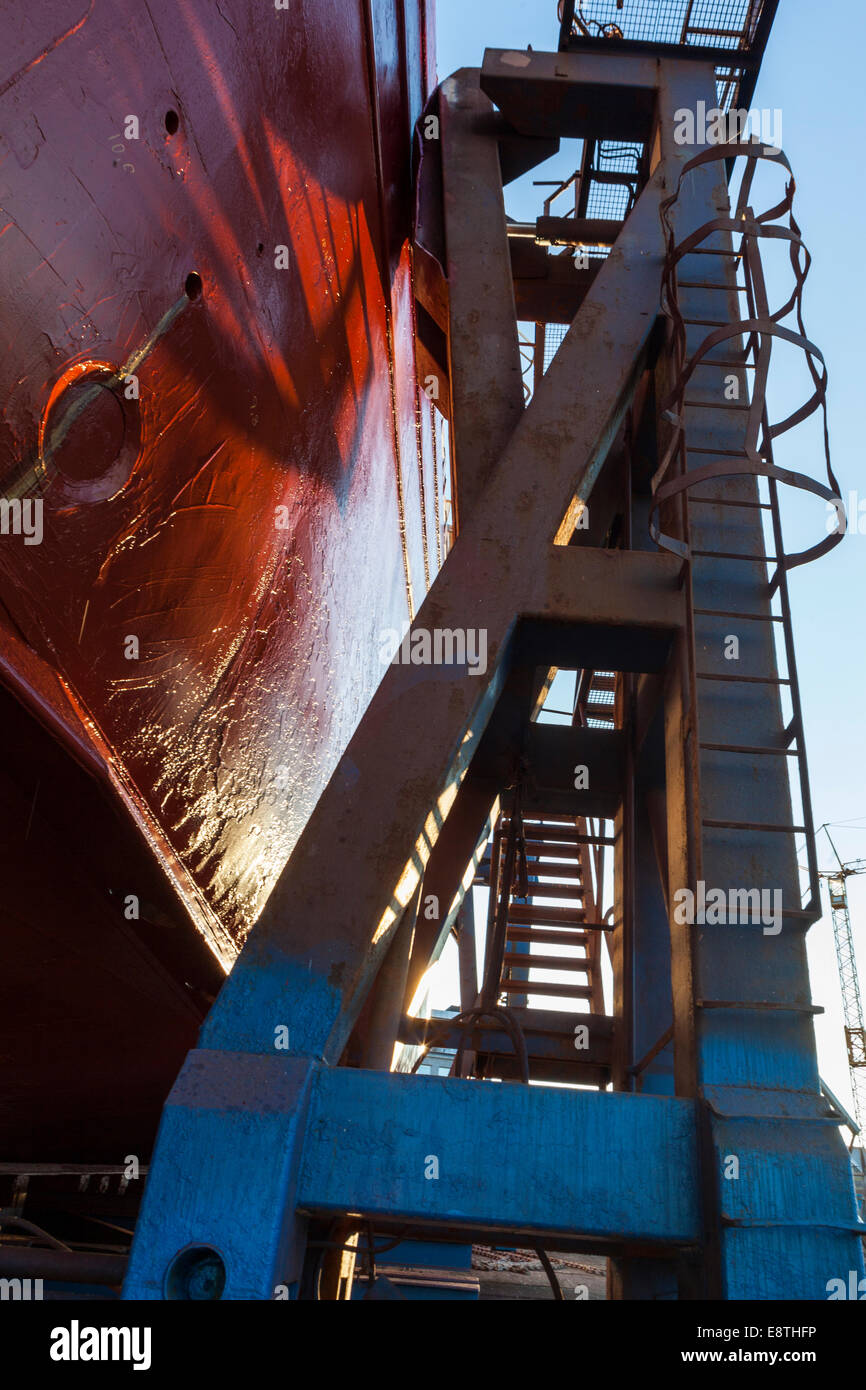 Steel gantry against steel hull of dry-docked trawler Stock Photo - Alamy