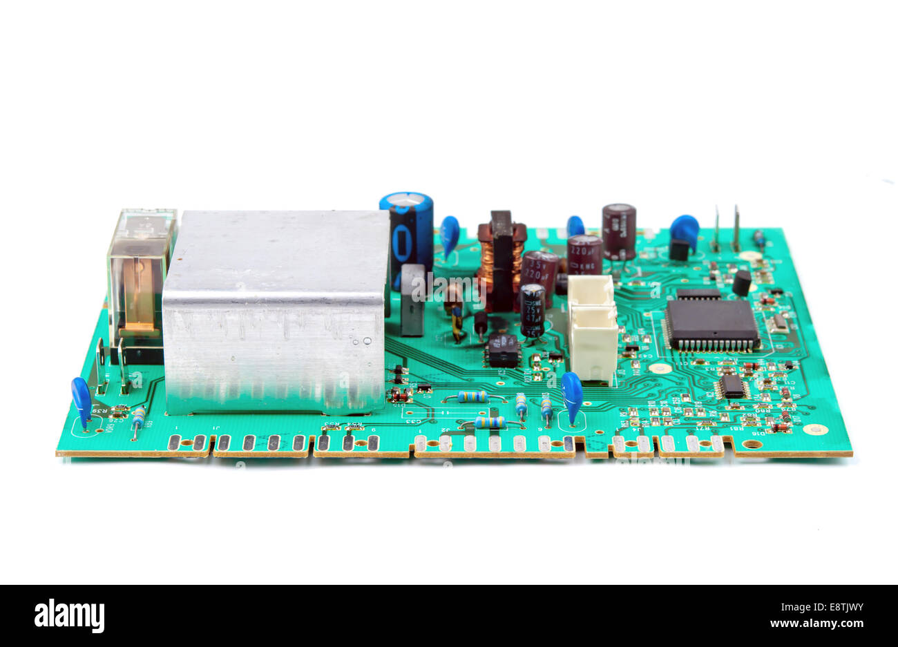 green electrical circuit board with conductors and transistors ...