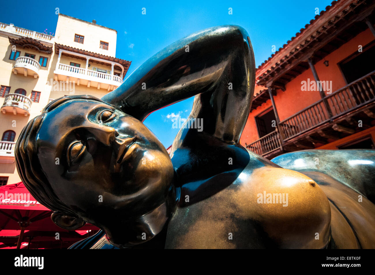 Statue of a fat woman reclining by Fernando Botero in the Plaza de ...