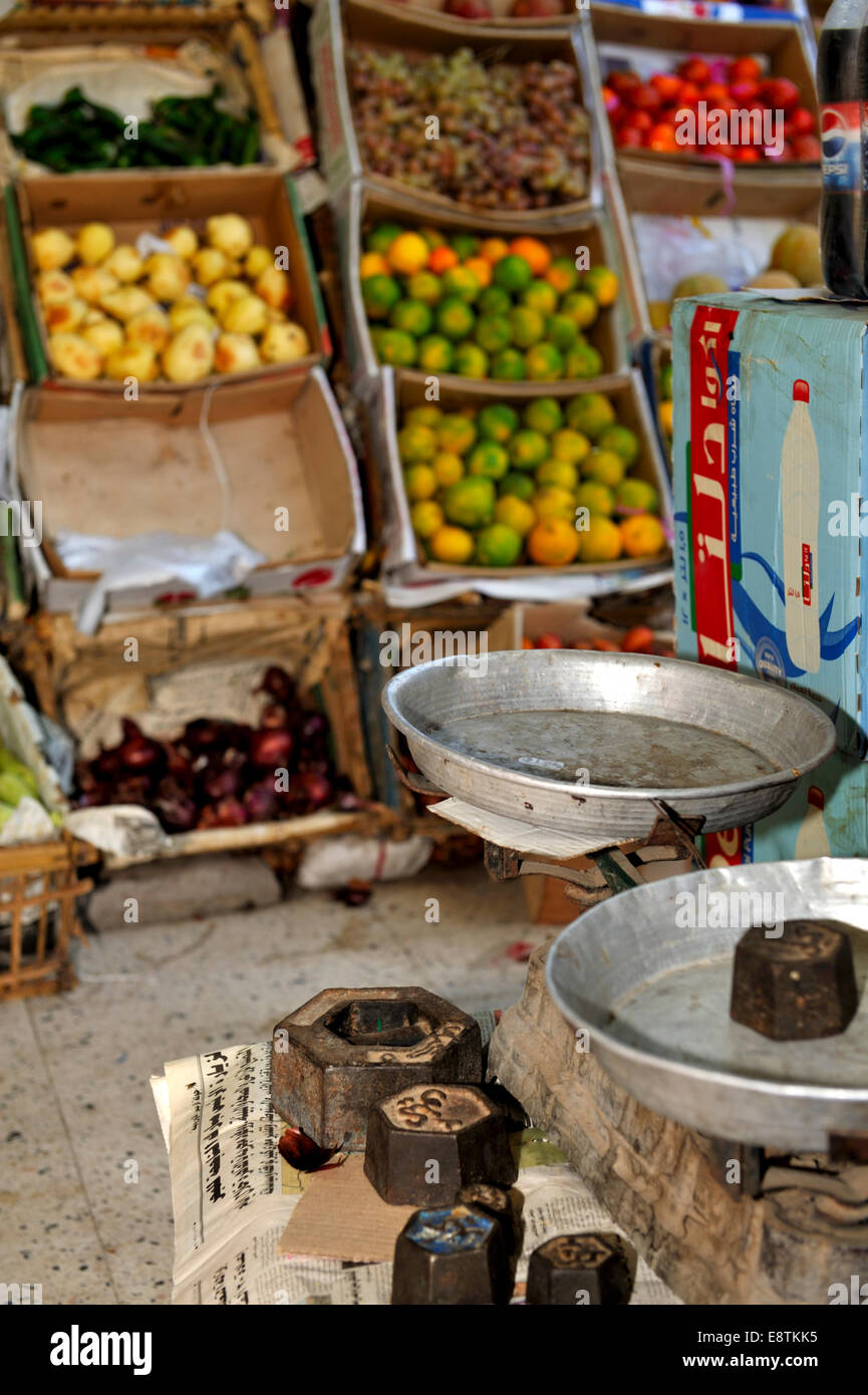 Inside a small food store selling fruit and vegetables with weighing ...