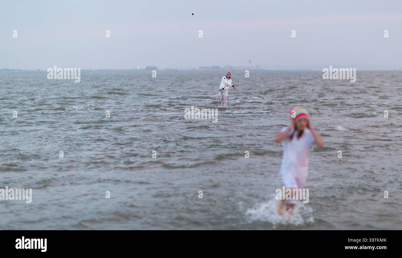 A player throws the ball back from deep in the outfield during the ...
