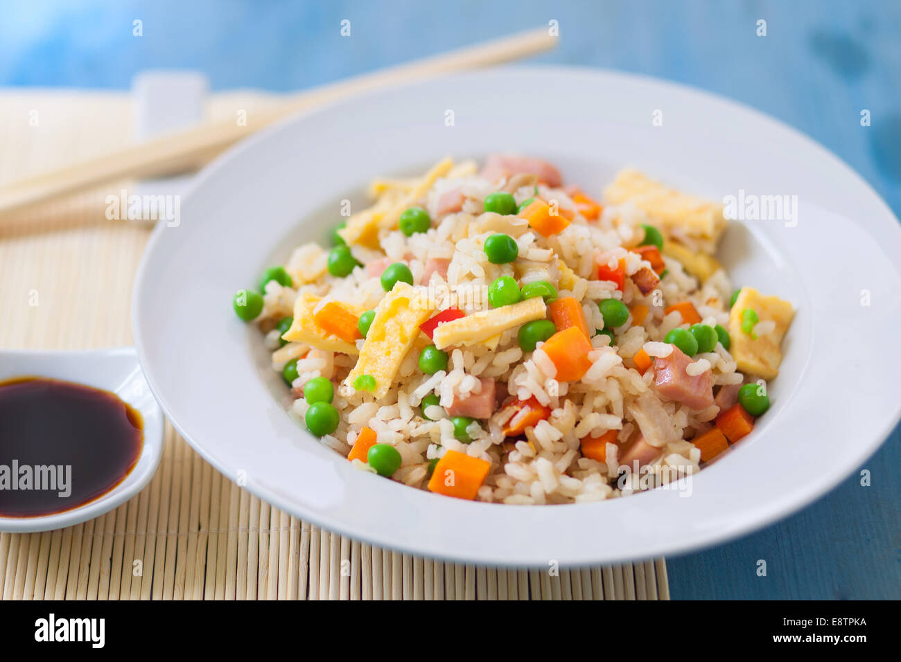 chinese fried rice with peas on white plate Stock Photo - Alamy