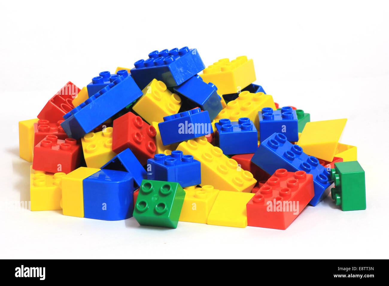 building blocks of different colours on white background Stock Photo ...