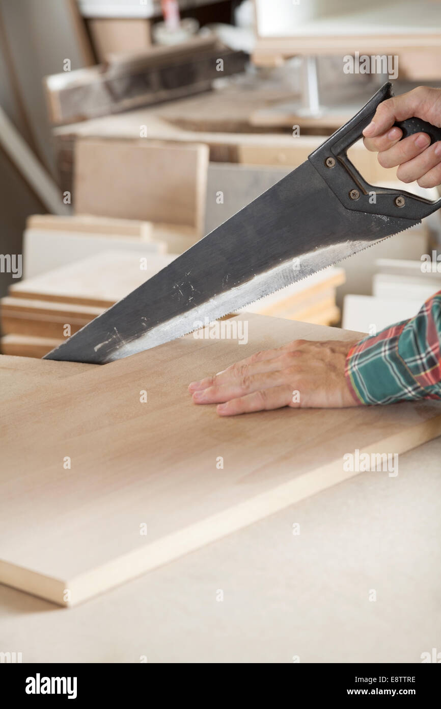 Sharp hand saw with wooden handle for cutting wood hi-res stock ...