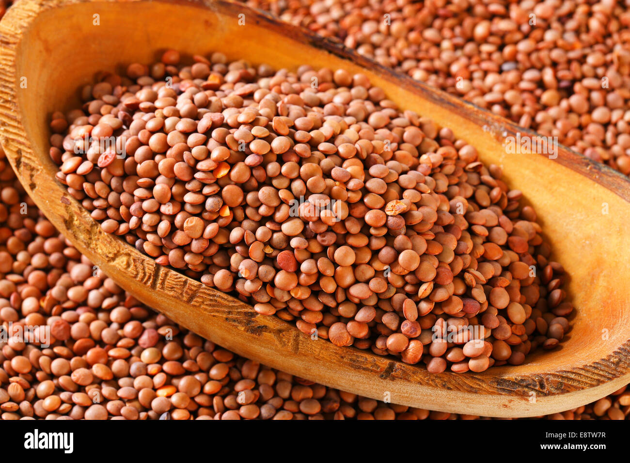 Whole red lentils in natural edge bowl Stock Photo - Alamy