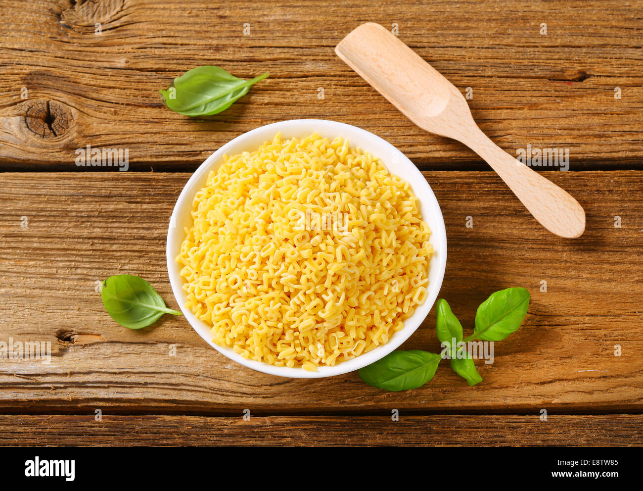 Plate of small letter-shaped pasta Stock Photo - Alamy