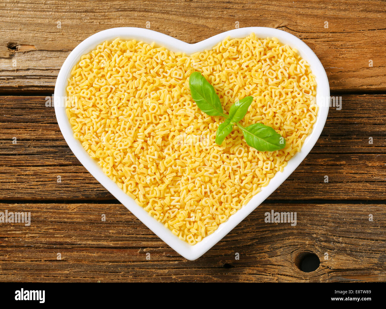 Plate of small letter-shaped pasta Stock Photo - Alamy