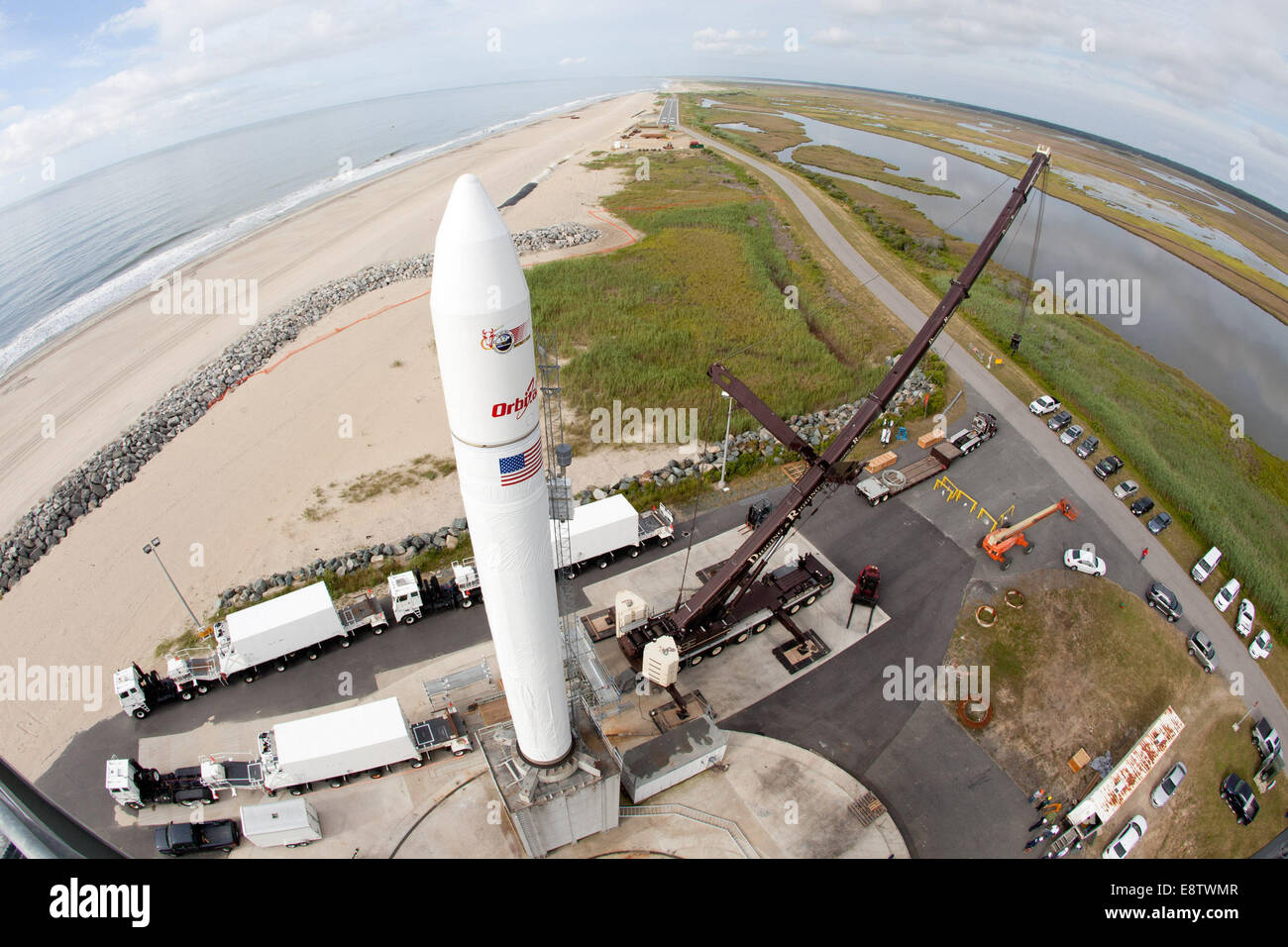 A wide-angle view of an inert Minotaur V launch vehicle is erected on ...