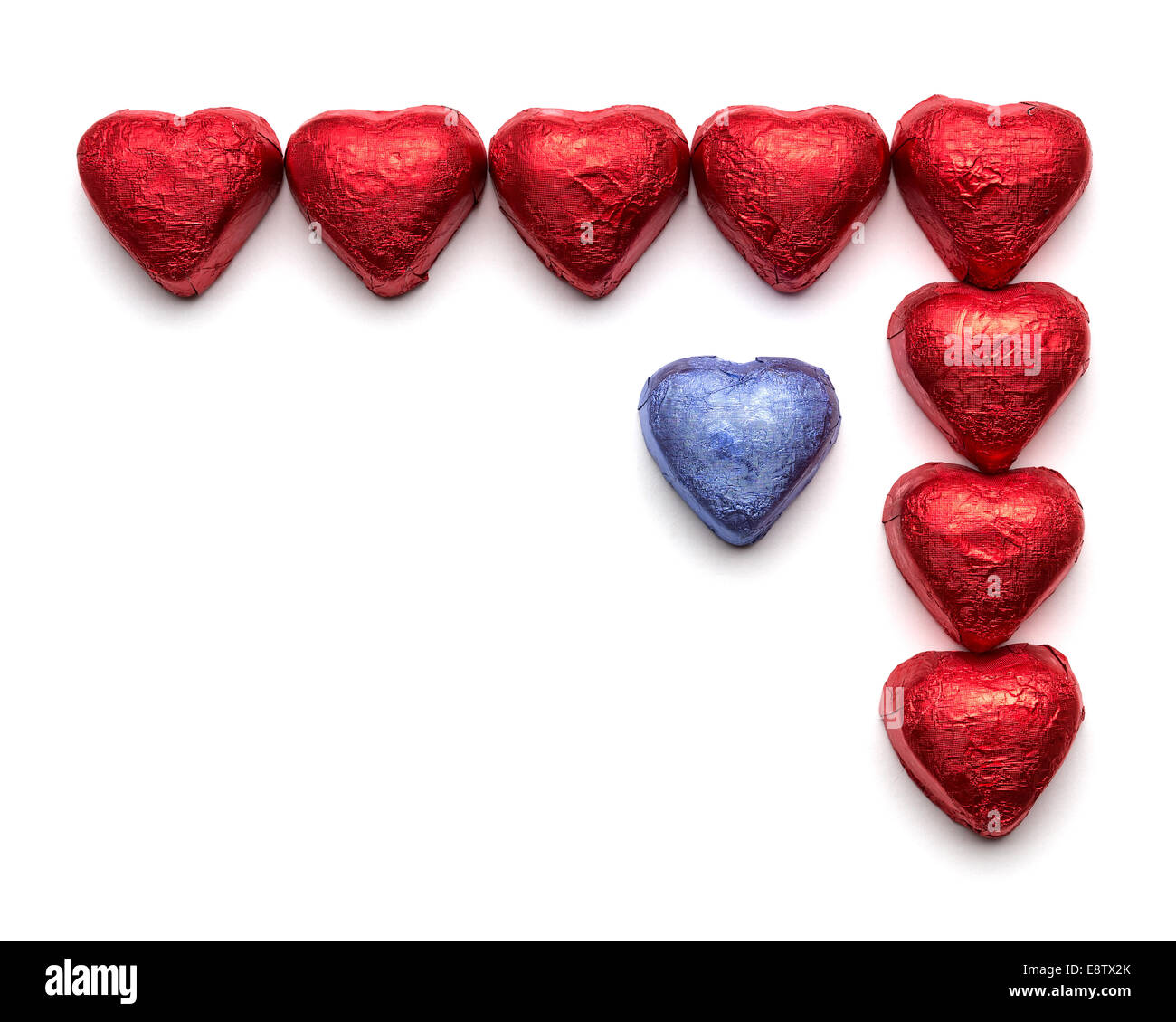 Foil wrapped chocolate heart Cut Out Stock Images & Pictures - Alamy