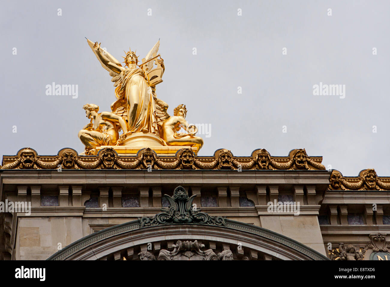 Close up of gold angel statue on top of Palais Garnier. The Opera ...