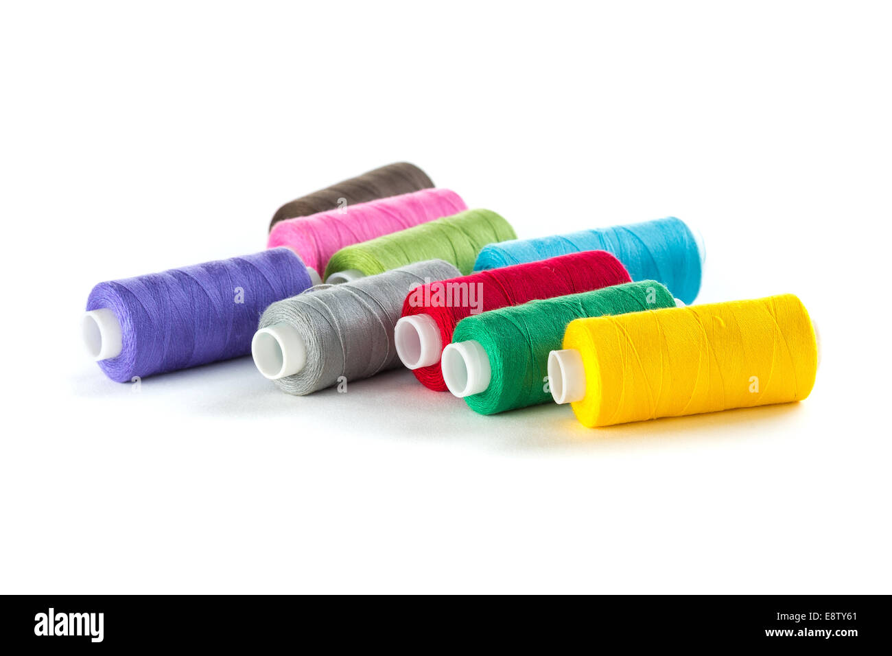 Bright bobbin thread isolated on white background Stock Photo - Alamy