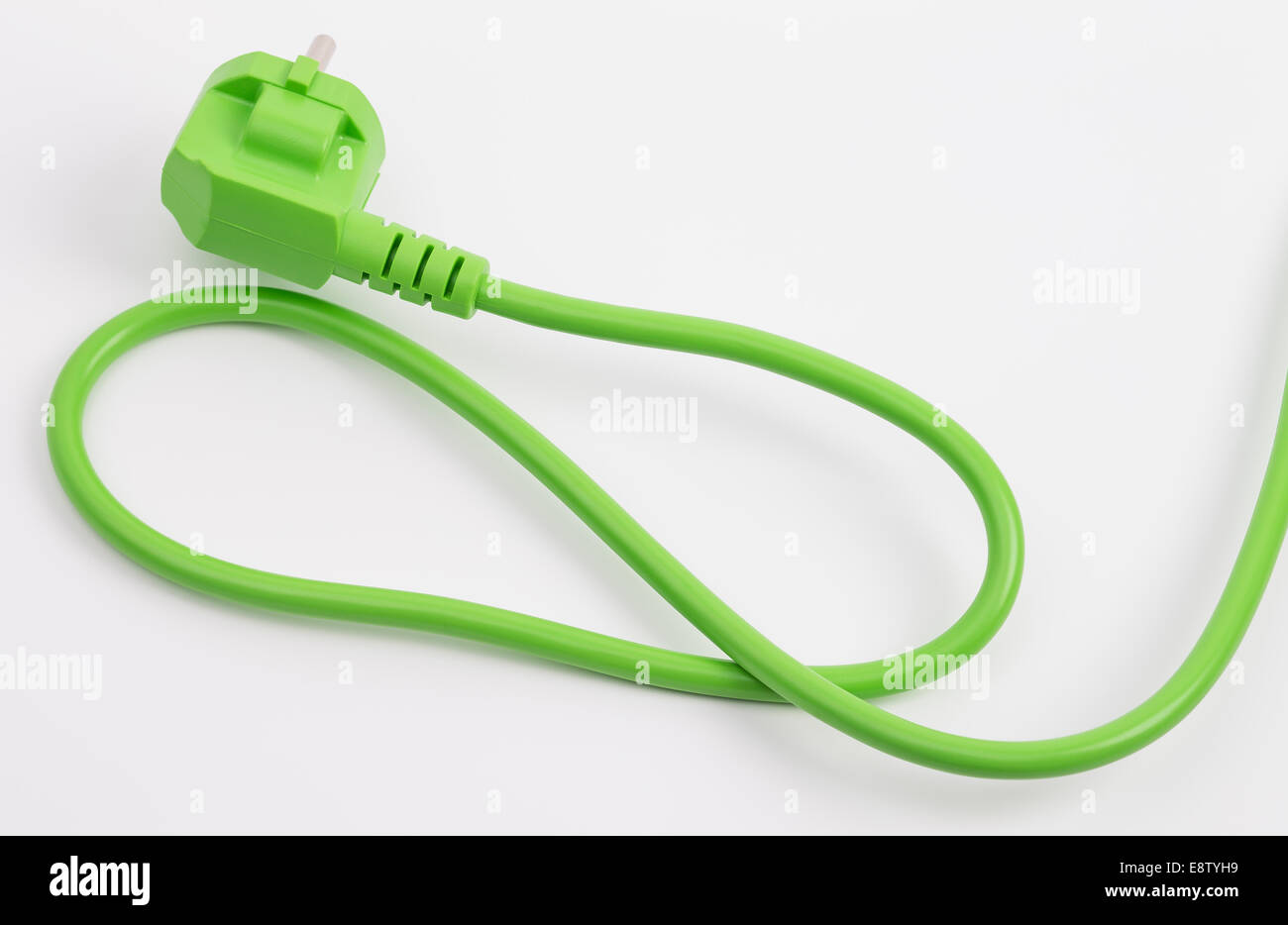 Green power plug isolated on white background Stock Photo - Alamy
