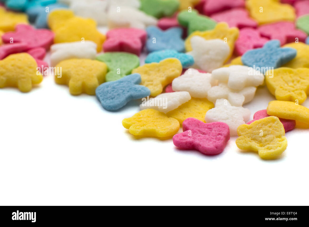 Colorful candy confetti on the white background Stock Photo - Alamy