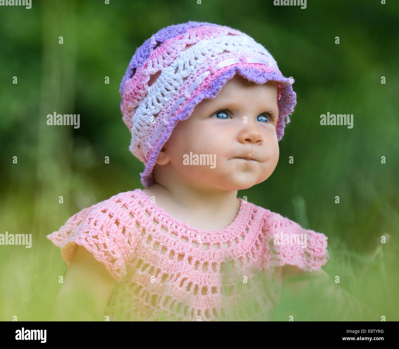 baby sitting in the grass outdoors in sunlight Stock Photo - Alamy