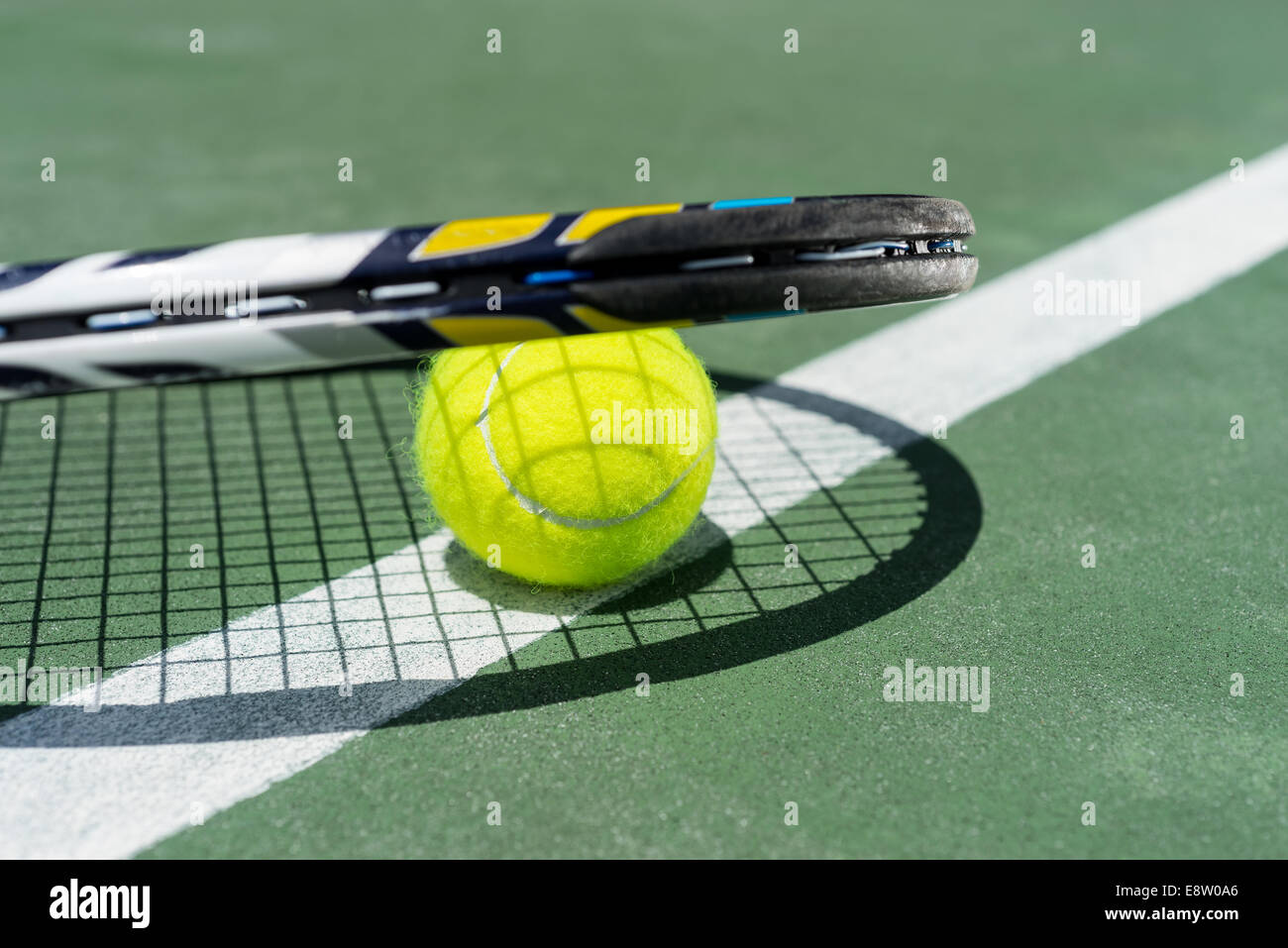 Close up view of tennis racket and balls on the clay tennis court Stock ...