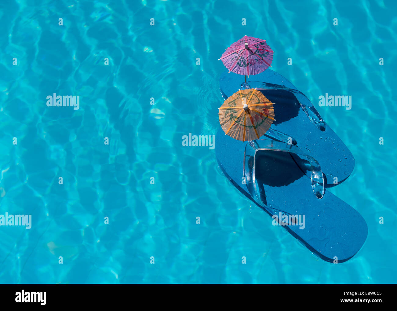 Flip Flop on pool with surface of water background Stock Photo - Alamy