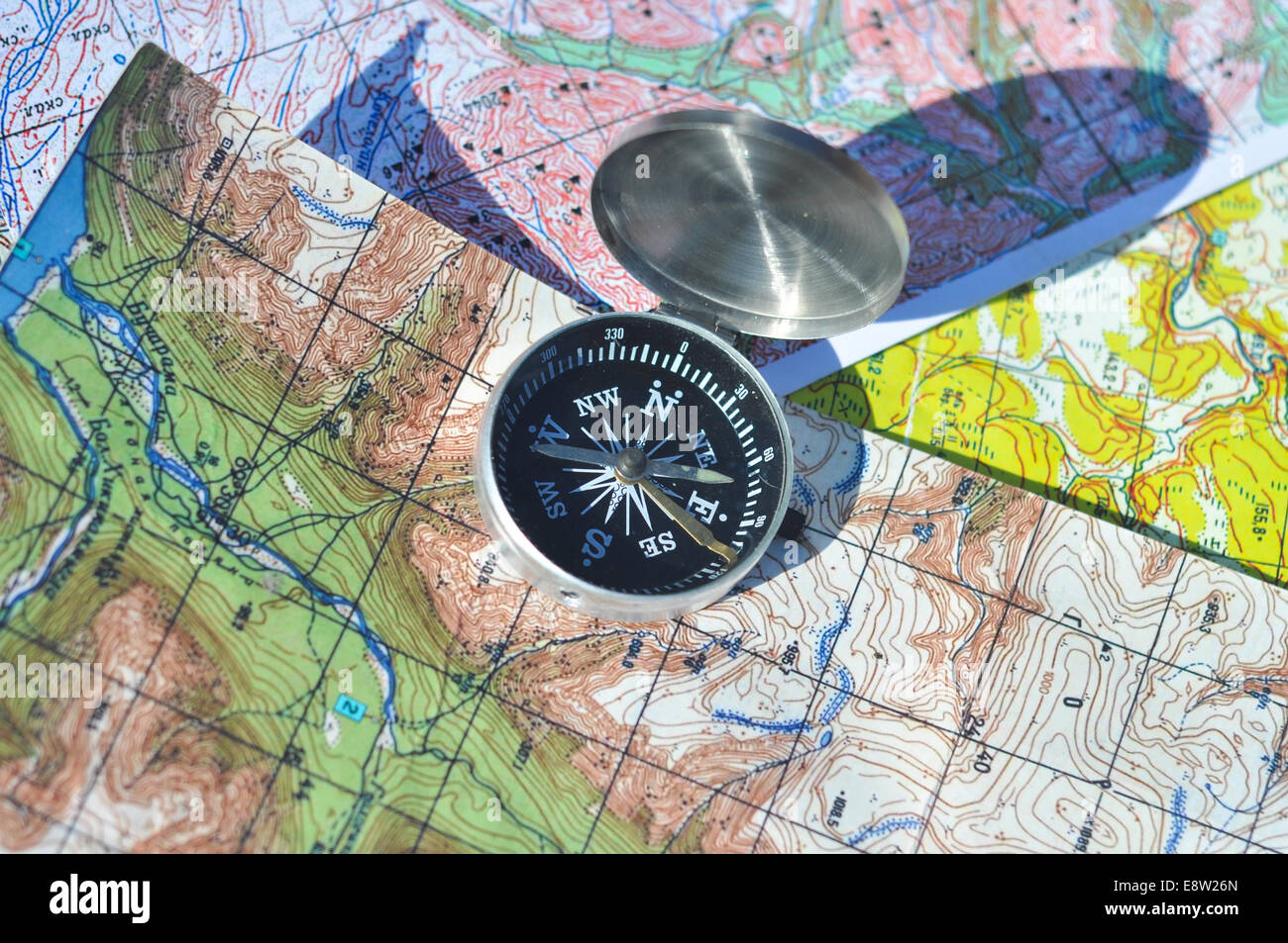 The compass on the map. Open the compass lies on topographic maps and ...