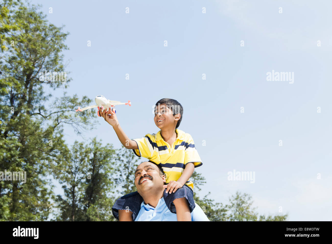 1 Indian Kid Flying Aeroplane with Father Stock Photo - Alamy