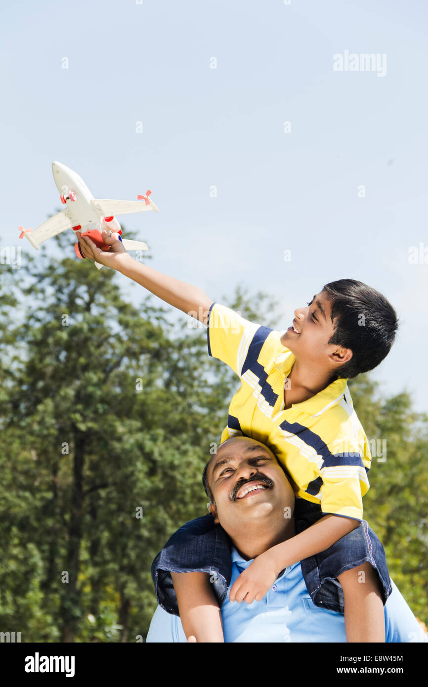 1 Indian Kid Flying Aeroplane with Father Stock Photo - Alamy
