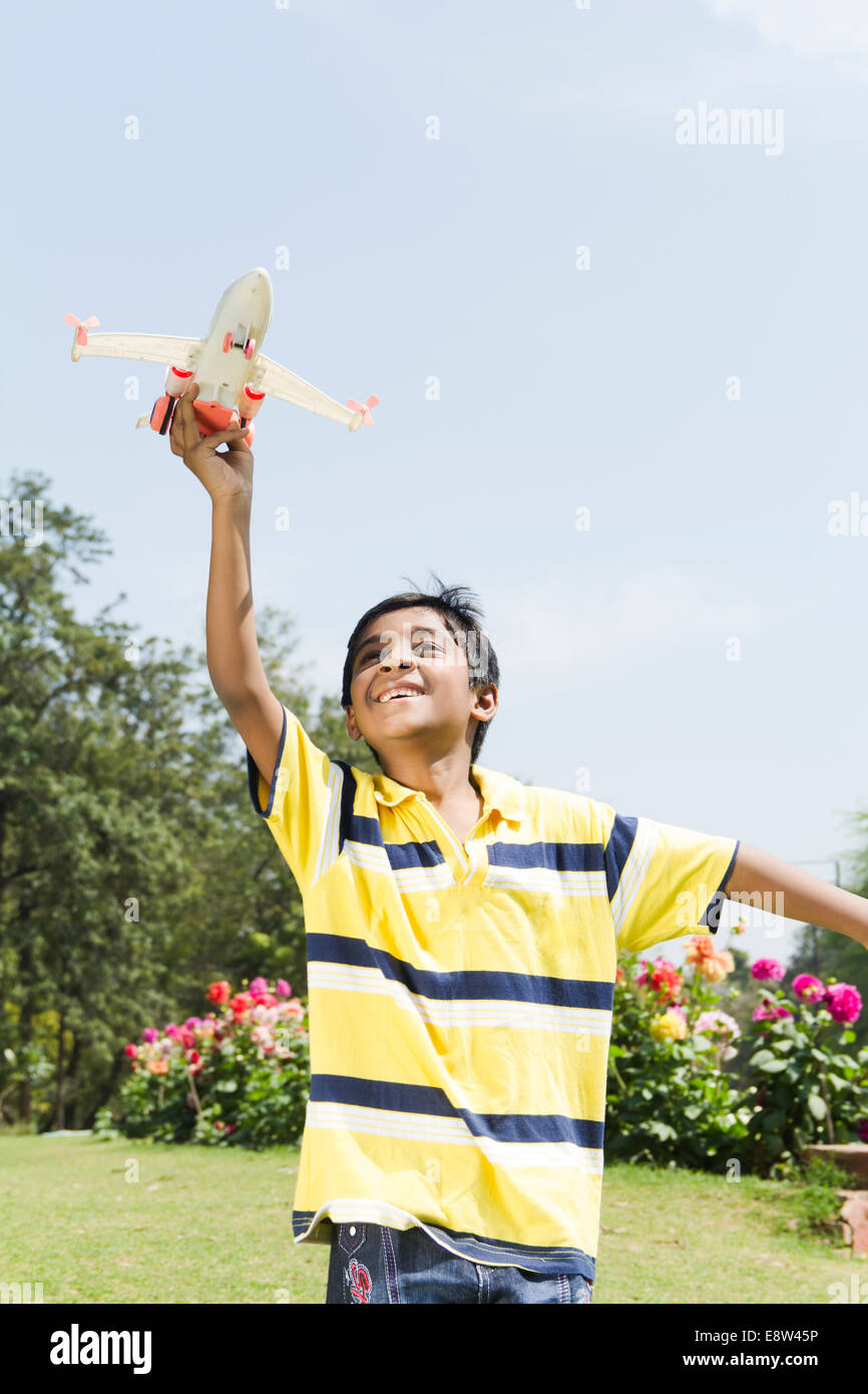 1 Indian Kid Flying Aeroplane in Park Stock Photo - Alamy