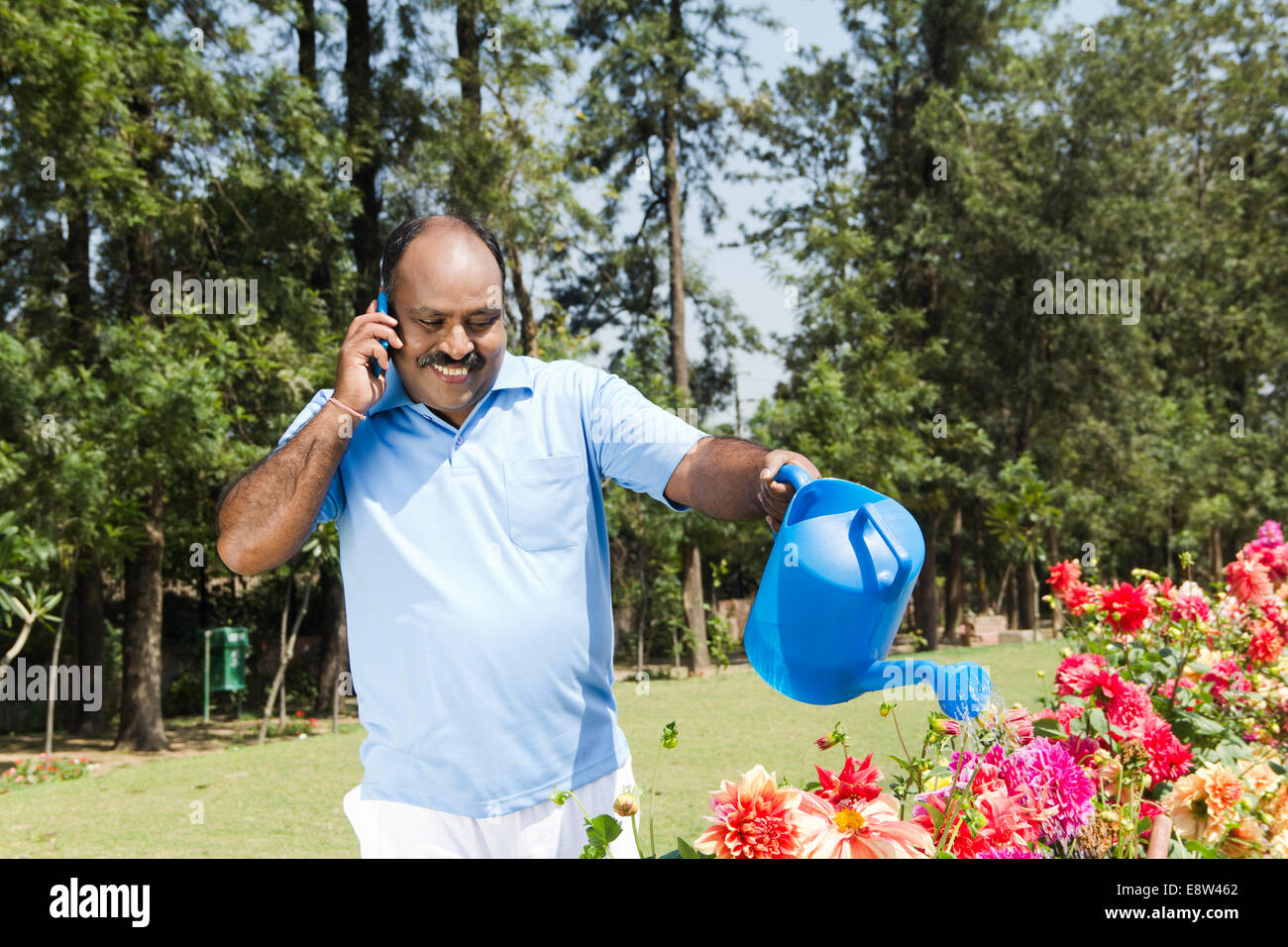 1 Indian Man Spraying Water Stock Photo - Alamy