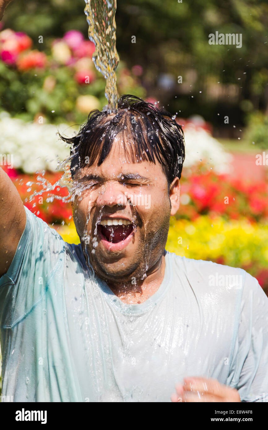 1 Indian Man Spraying Water and Bathing Stock Photo - Alamy