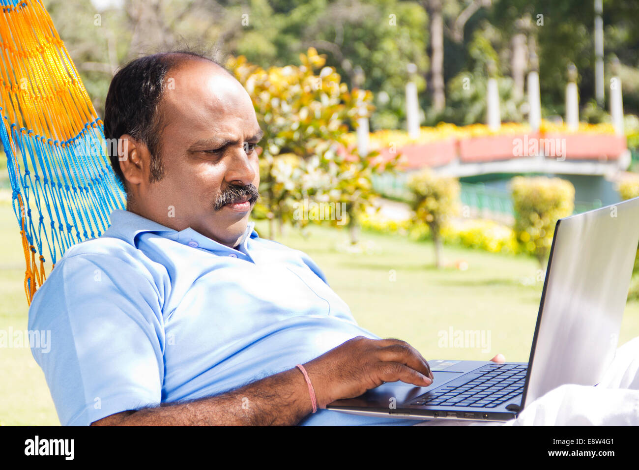 Indian man with laptop hi-res stock photography and images - Alamy