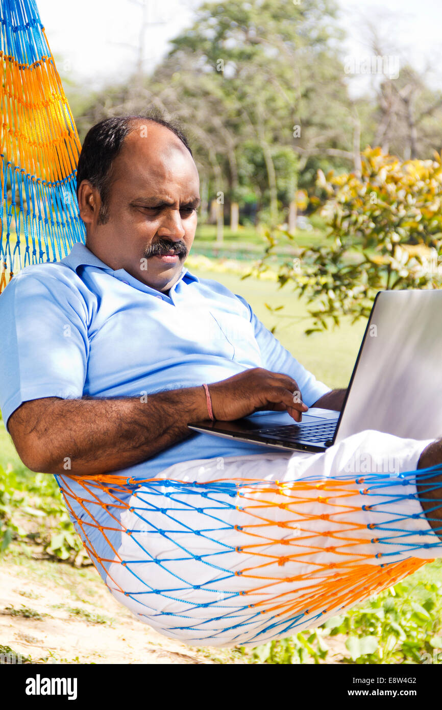 Indian man with laptop hi-res stock photography and images - Alamy