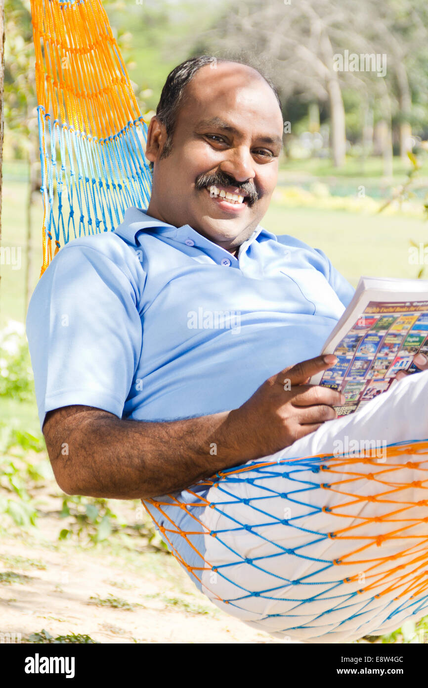 1 Indian an Reading Book In Park Stock Photo - Alamy