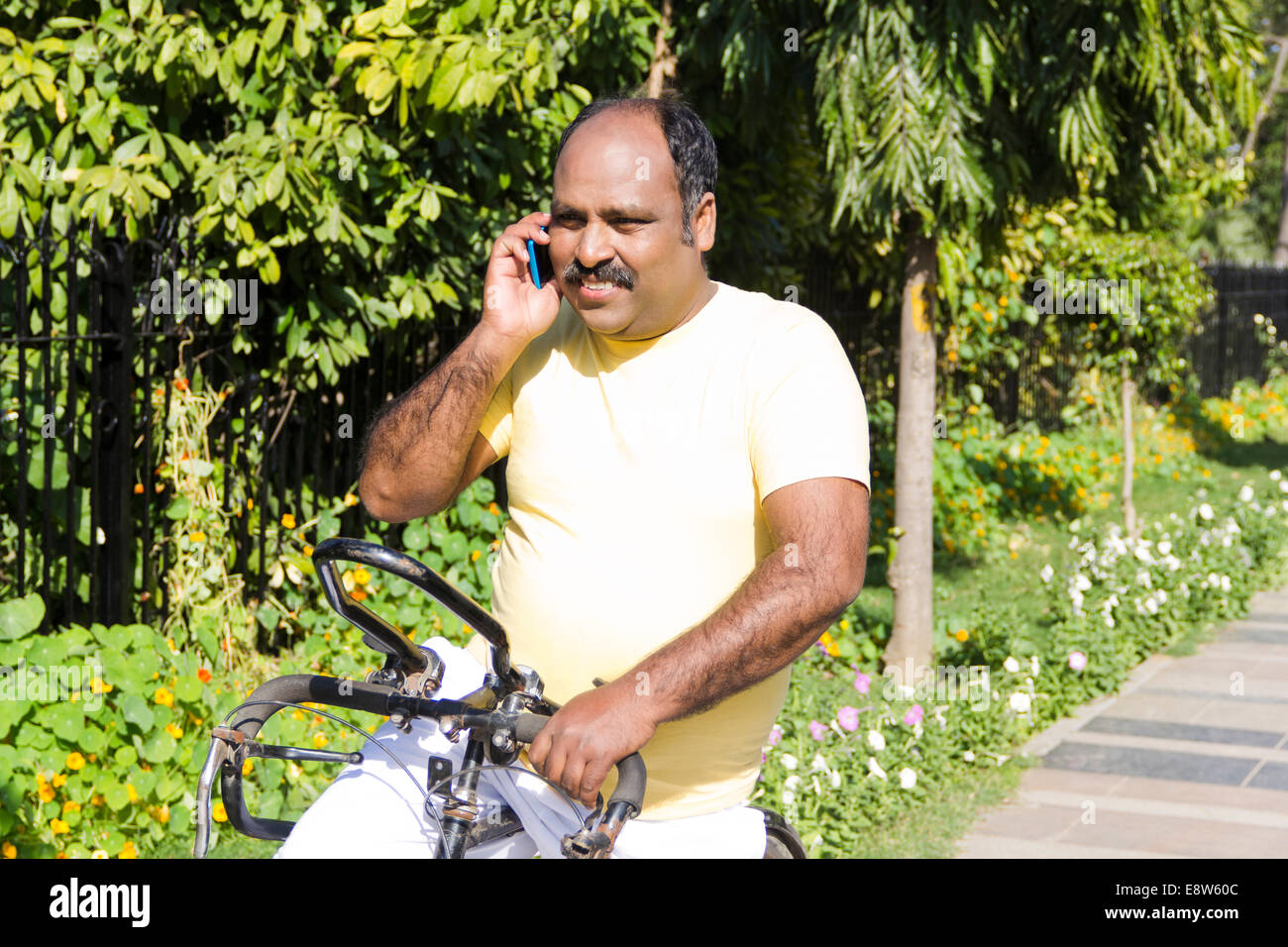 Indian man with cycle hi-res stock photography and images - Alamy