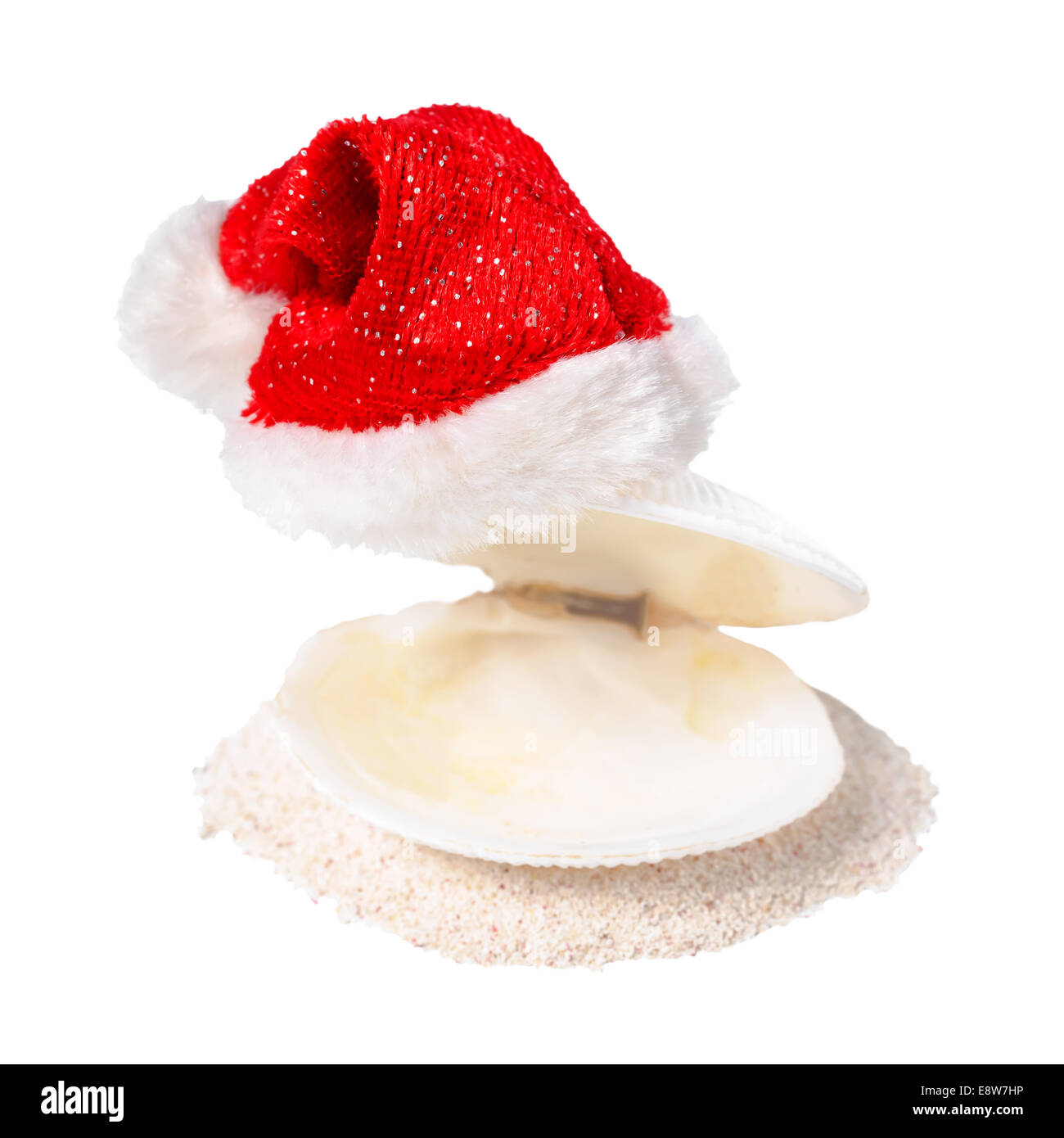 tropical concept of Christmas with red Santa Claus hats on shell ...