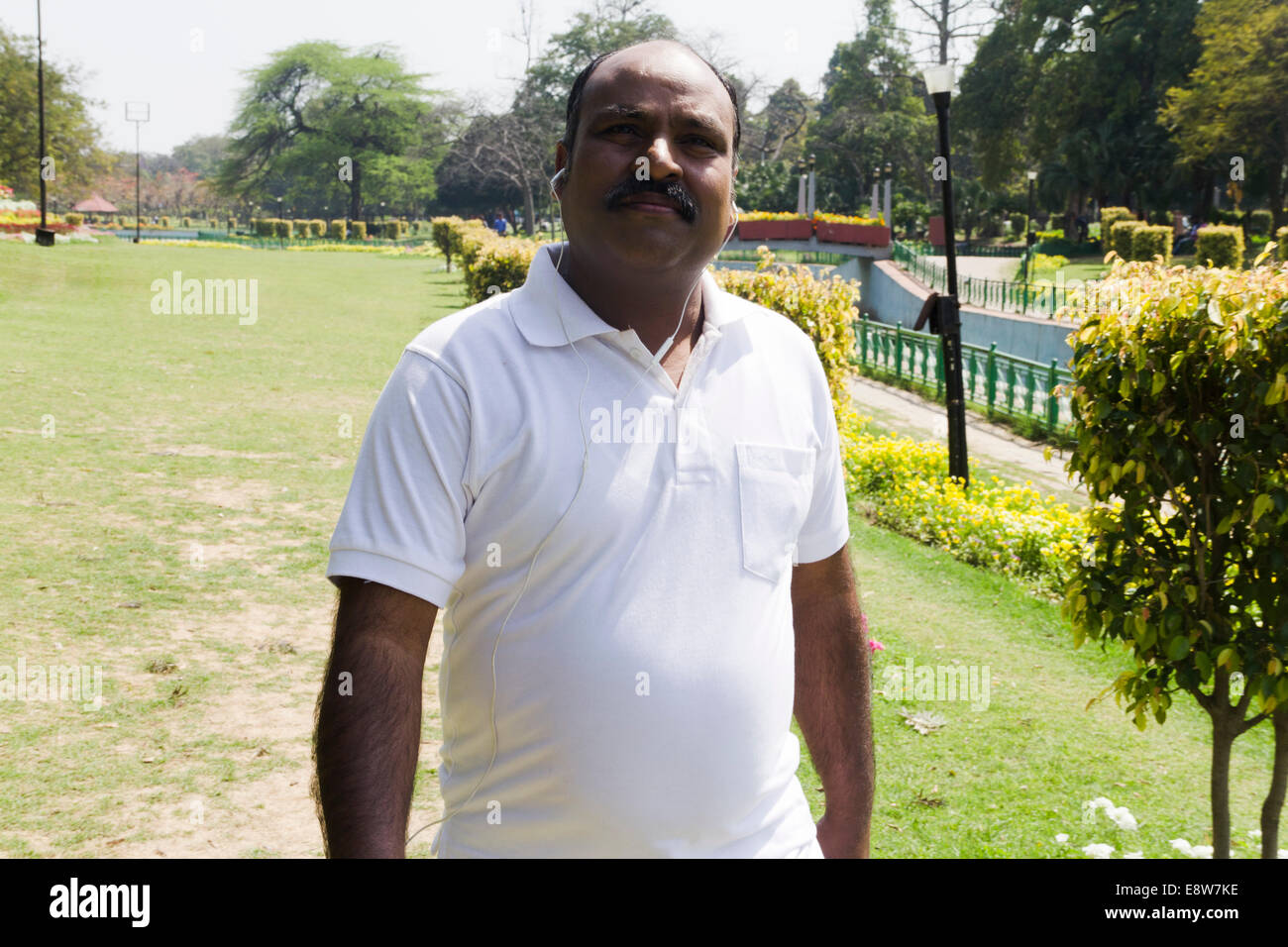 1 Indian Man Standing In Park Stock Photo - Alamy