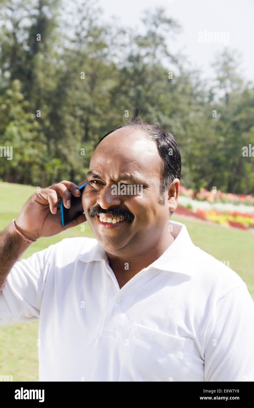 Indian male 50s phone hi-res stock photography and images - Alamy