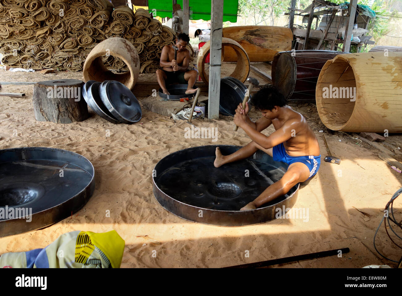 Gongs and drums in making. Shaping gong with hammer.tradesman,skills ...