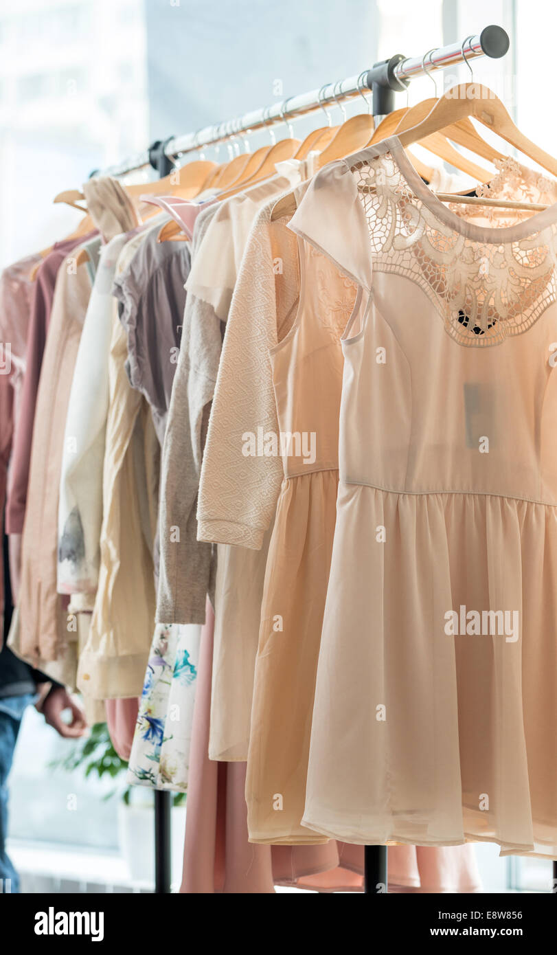 Dresses on hangers hi-res stock photography and images - Alamy