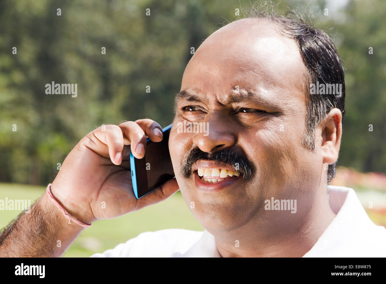 1 Indian Man Talking with Mobile Stock Photo - Alamy
