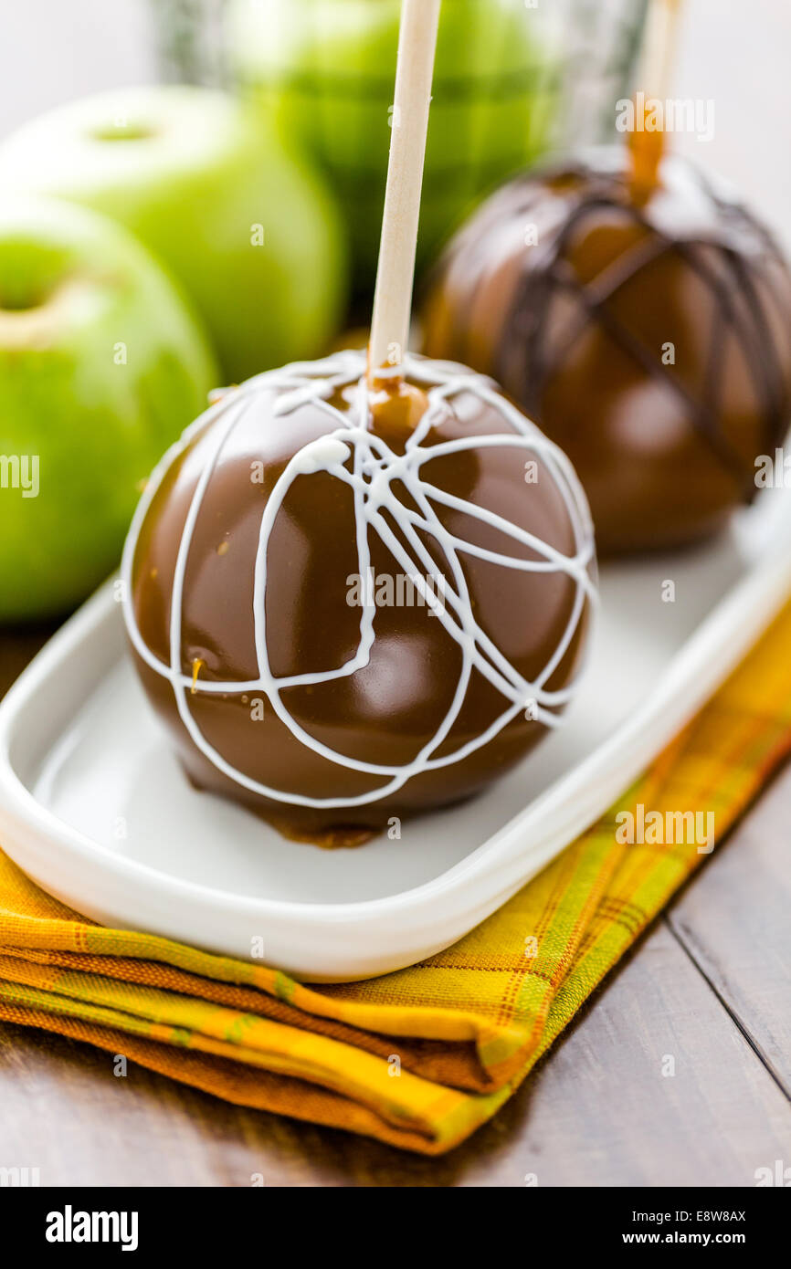 Hand dipped caramel apples decorated for Halloween Stock Photo - Alamy