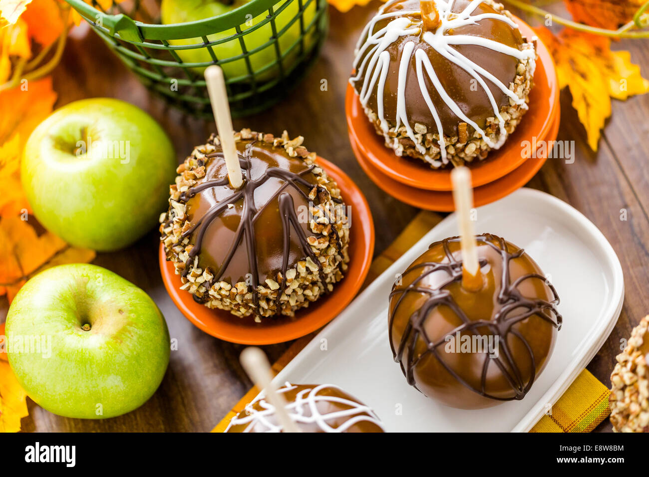 Hand dipped caramel apples decorated for Halloween Stock Photo - Alamy