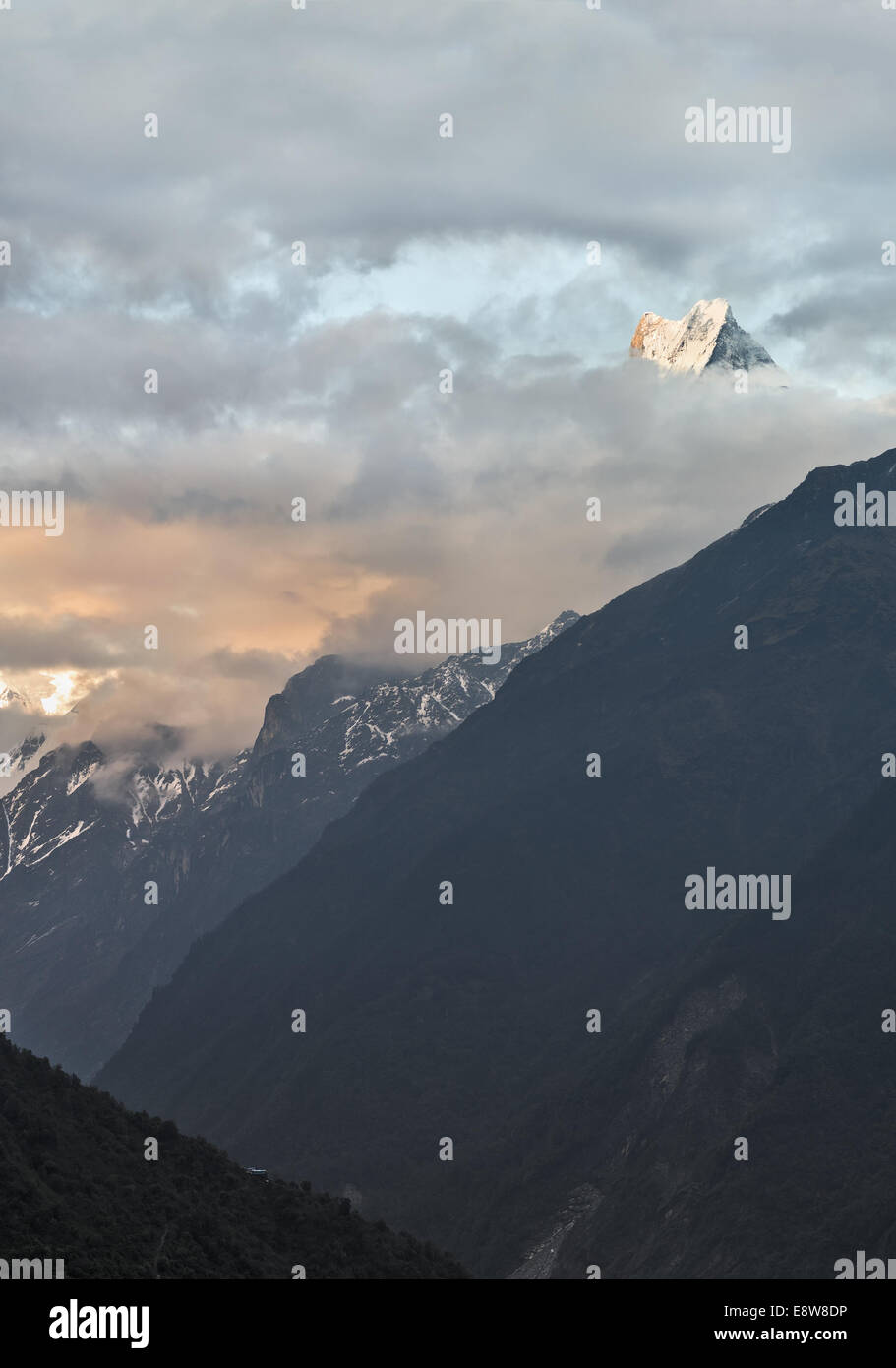 View of snow-capped peaks of Mount Machapuchare in the rays of the ...