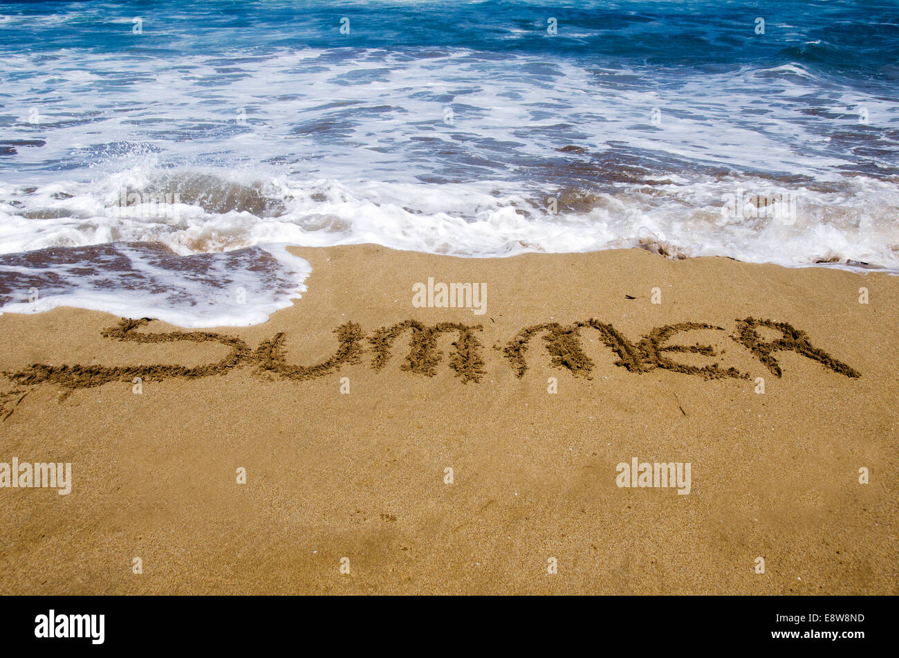 The word summer written in the sand on a beach Stock Photo - Alamy