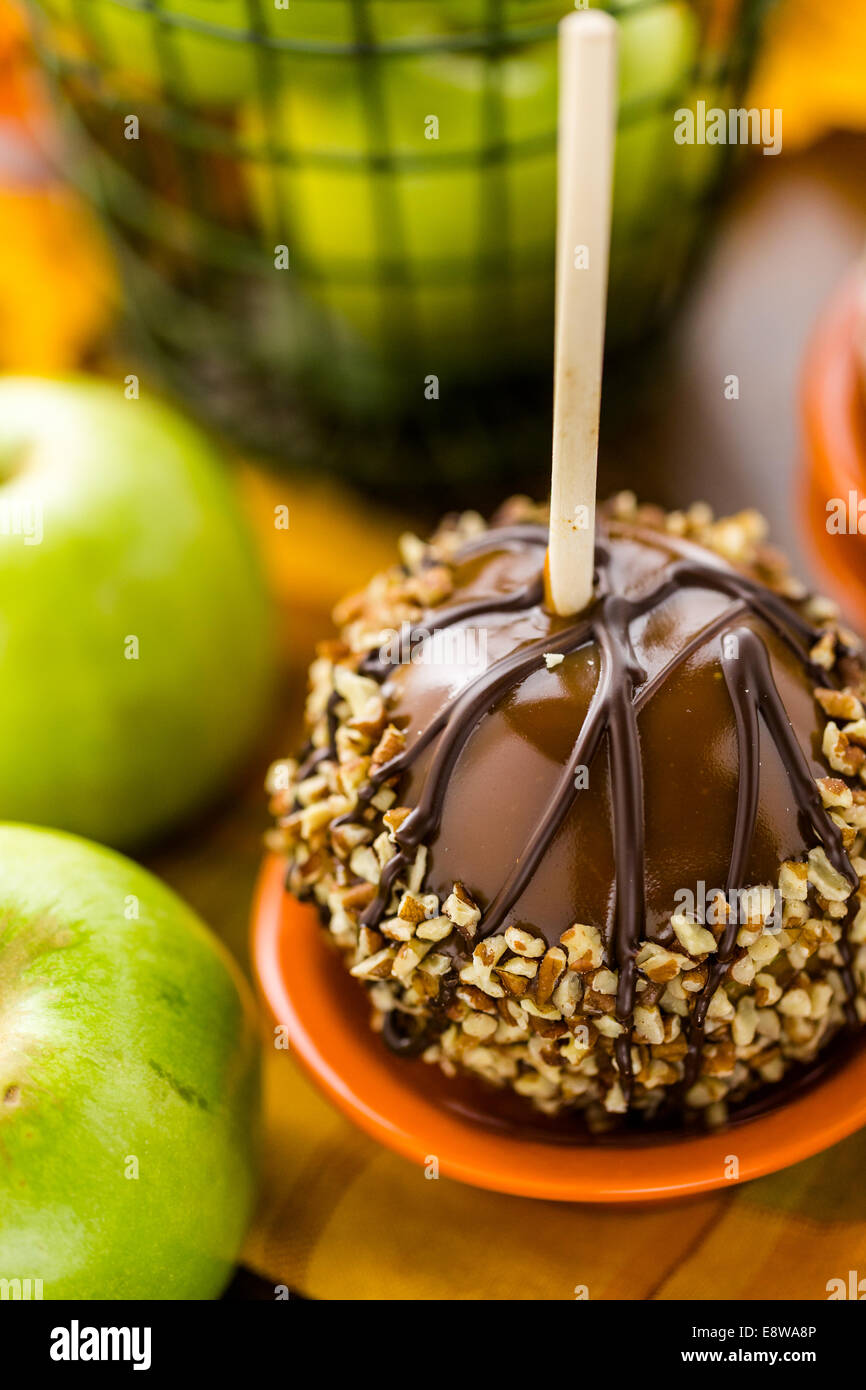 Hand dipped caramel apples decorated for Halloween Stock Photo - Alamy