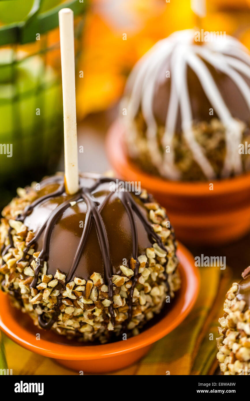 Hand dipped caramel apples decorated for Halloween Stock Photo - Alamy