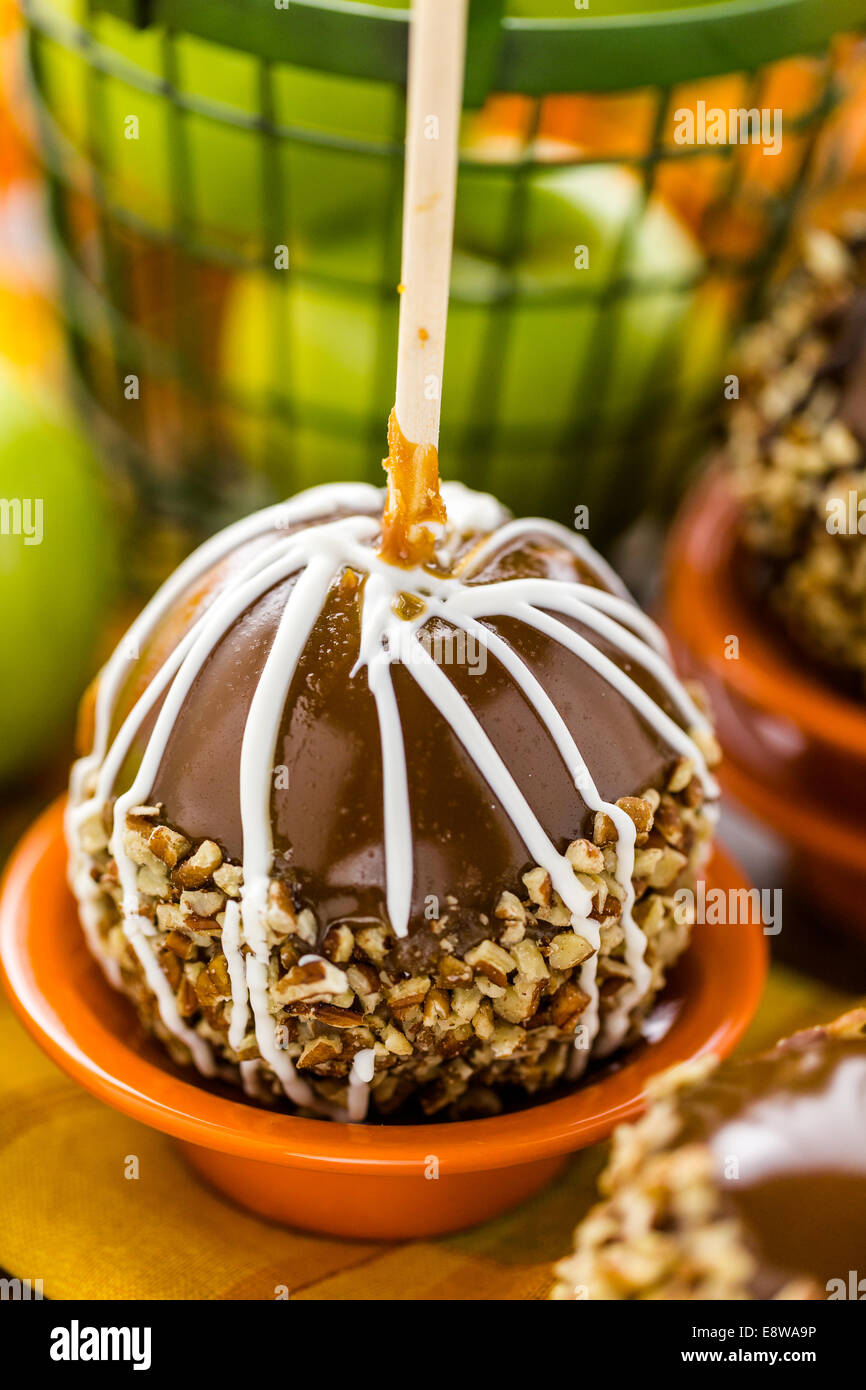 Hand dipped caramel apples decorated for Halloween Stock Photo - Alamy