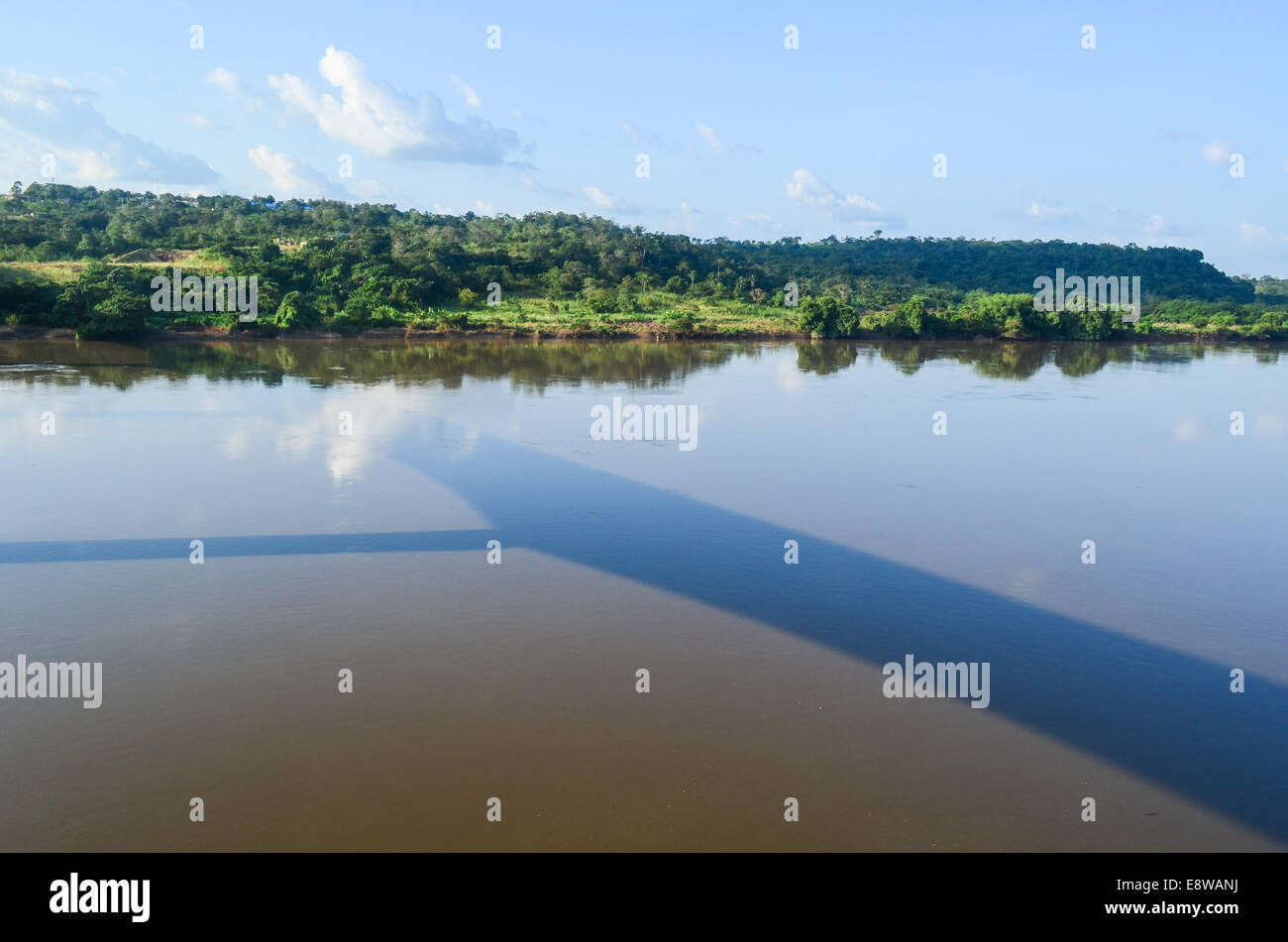 The Cross River in Nigeria from a modern bridge, which shadow appears ...