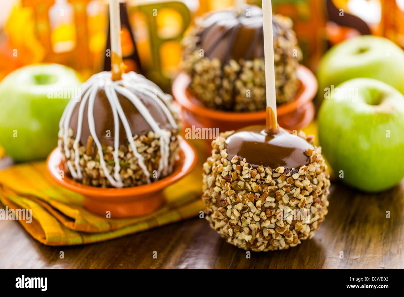 Hand dipped caramel apples decorated for Halloween Stock Photo - Alamy